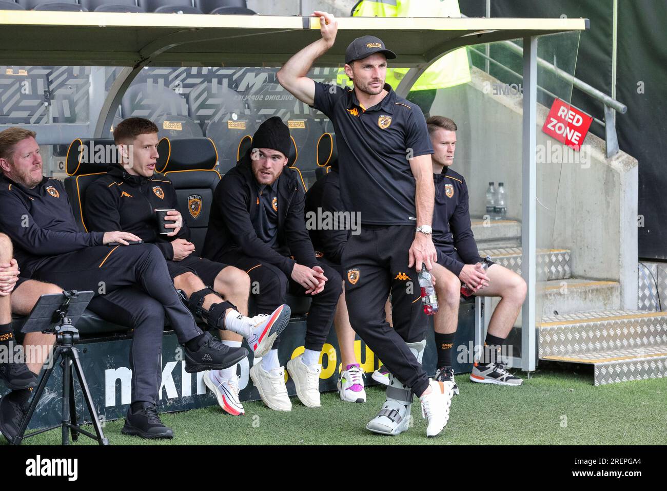 Aaron Connolly and Lewie Coyle of Hull City in the dugout ahead of the ...