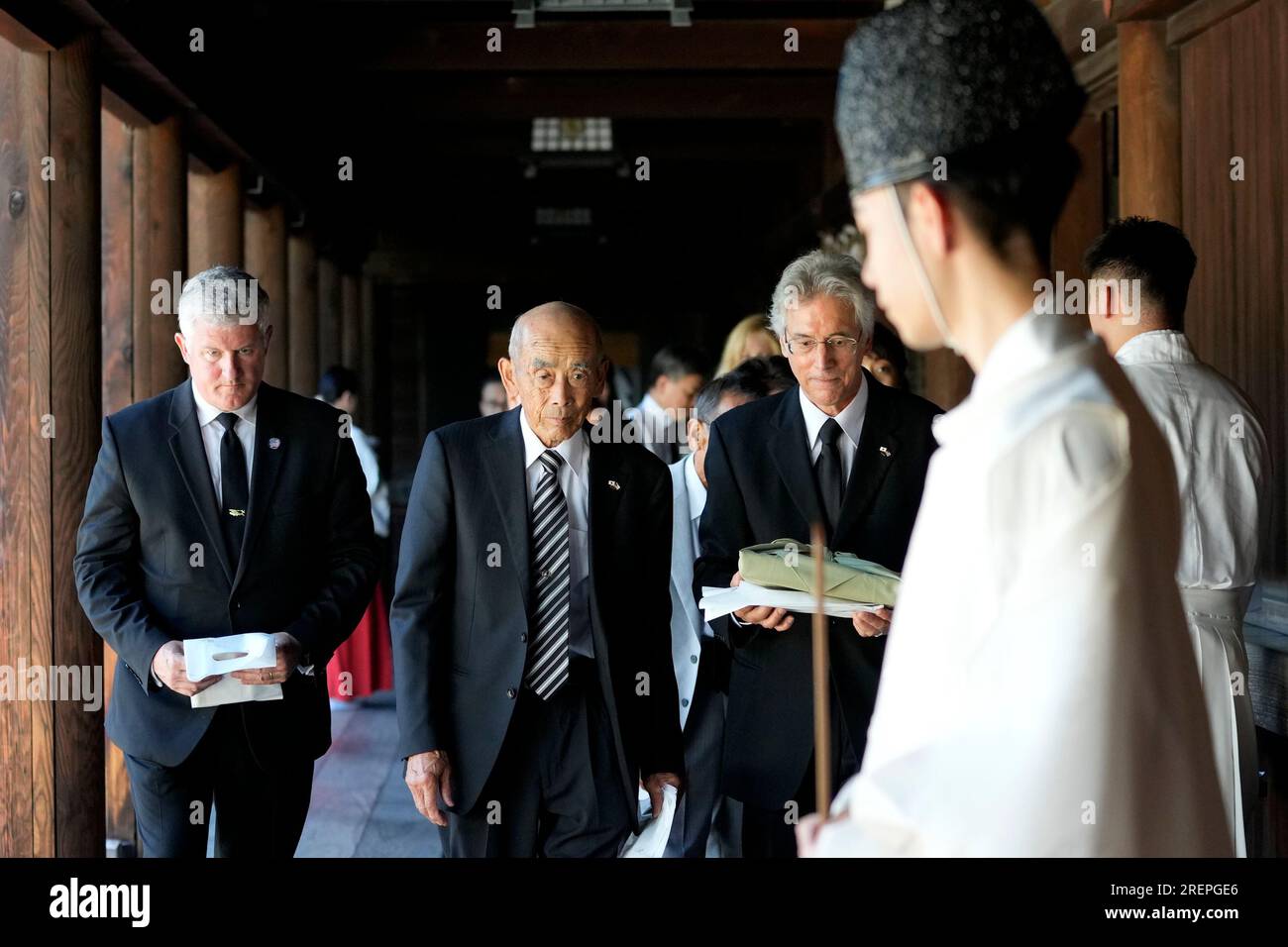 Toshihiro Mutsuda, center, the elderly son of Japanese soldier ...
