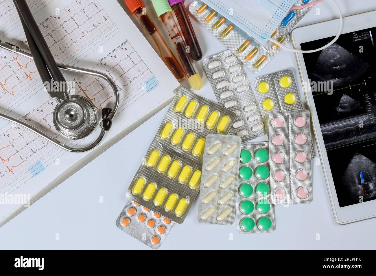 Doctor utilizes digital tablet to monitor patient heart using ...