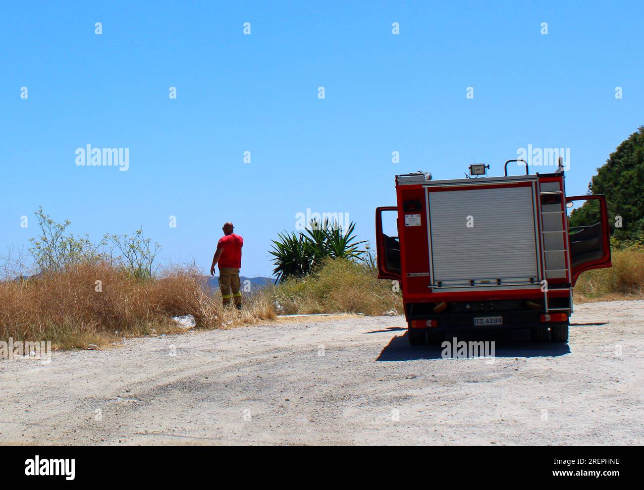 Greek Firefighter looking for new wildfires from mountain top in ...