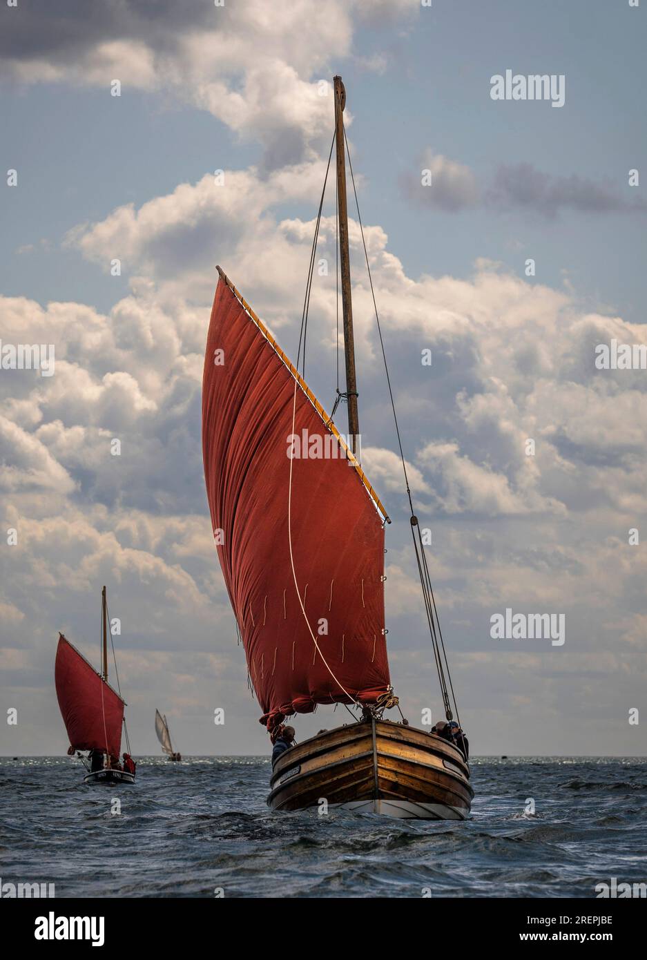 Traditional Coble fishing boats are sailed off the coast of Bridlington ...