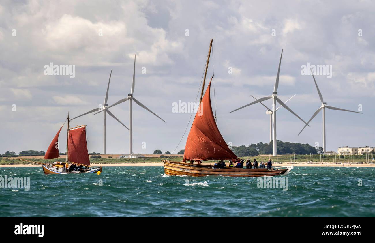 Traditional Coble fishing boats are sailed off the coast of Bridlington ...