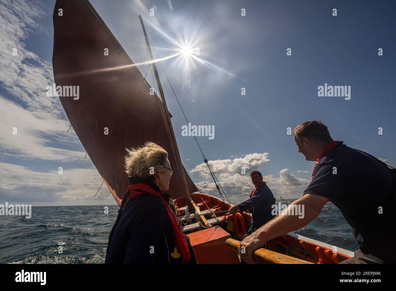 A traditional Coble fishing boat is sailed off the coast of Bridlington ...