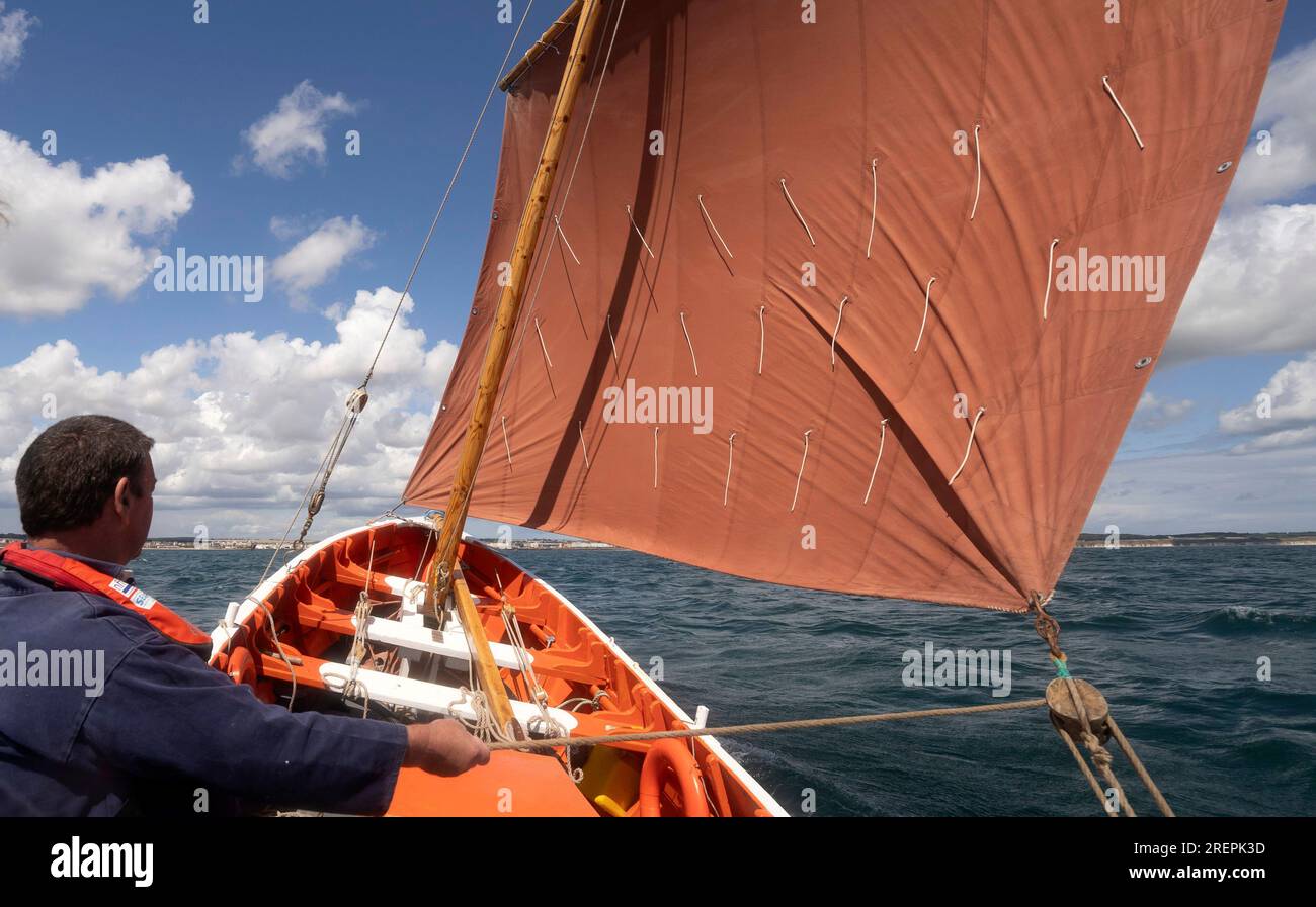 A traditional Coble fishing boat is sailed off the coast of Bridlington ...