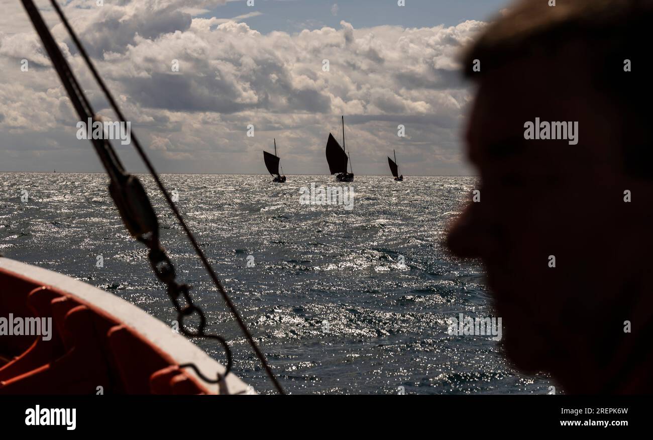 Traditional Coble fishing boats are sailed off the coast of Bridlington ...