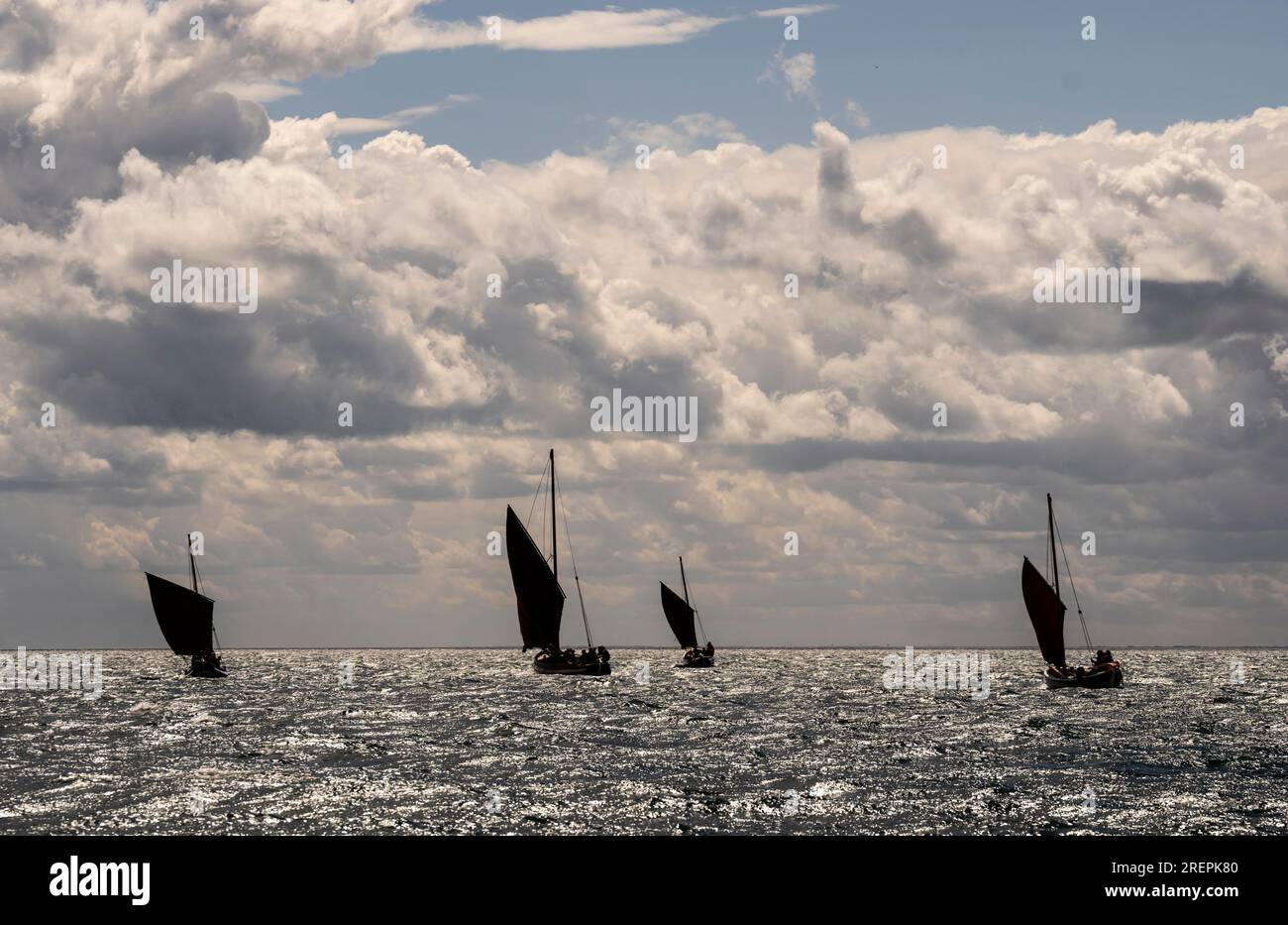 Traditional Coble fishing boats are sailed off the coast of Bridlington ...