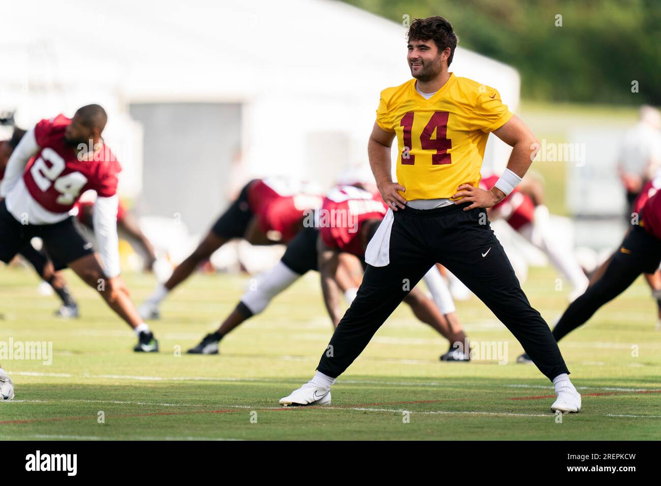 Washington Commanders quarterback Sam Howell stretches at the beginning ...