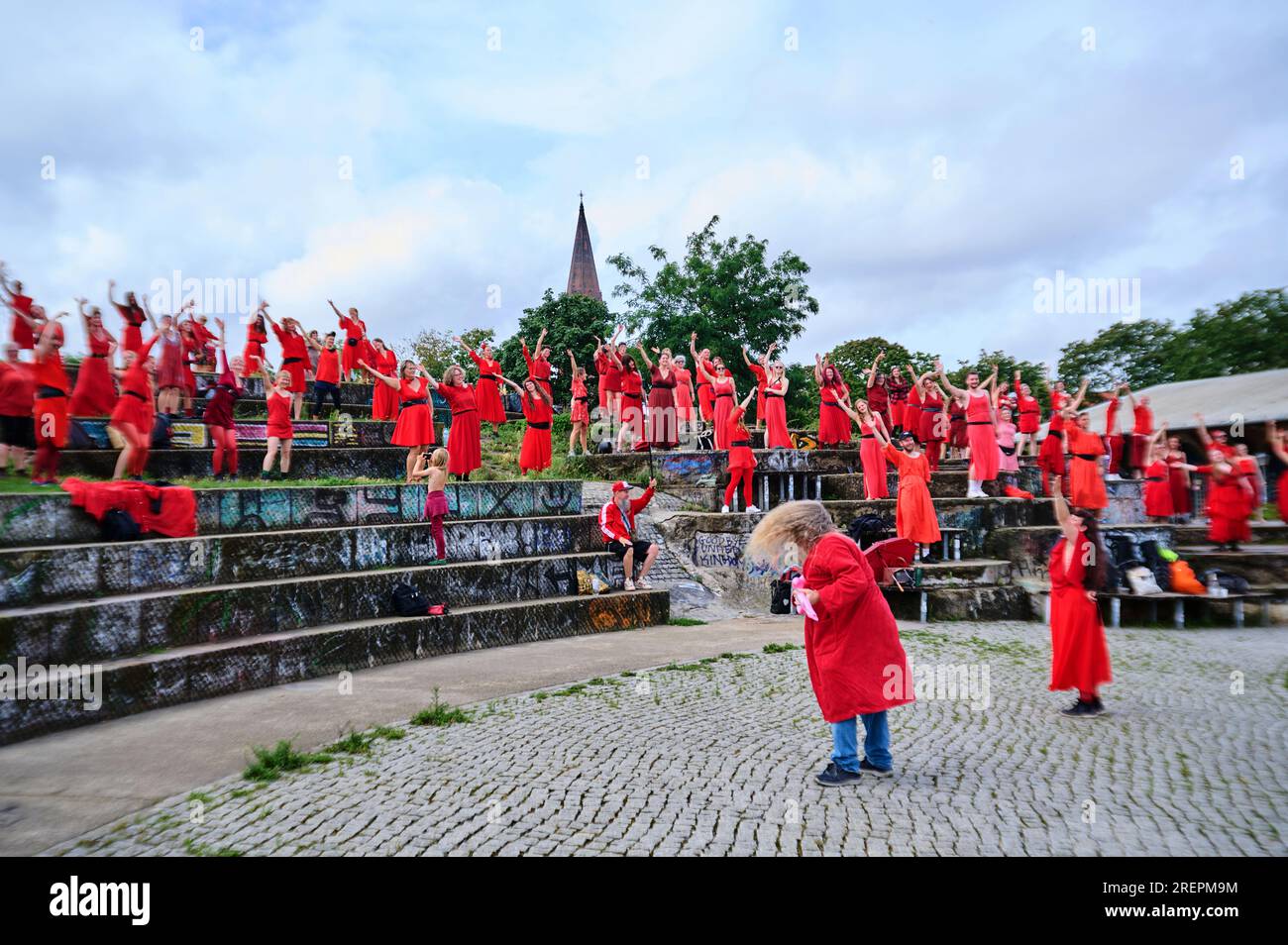 Berlin, Germany. 29th July, 2023. Women and men dressed in red dance ...