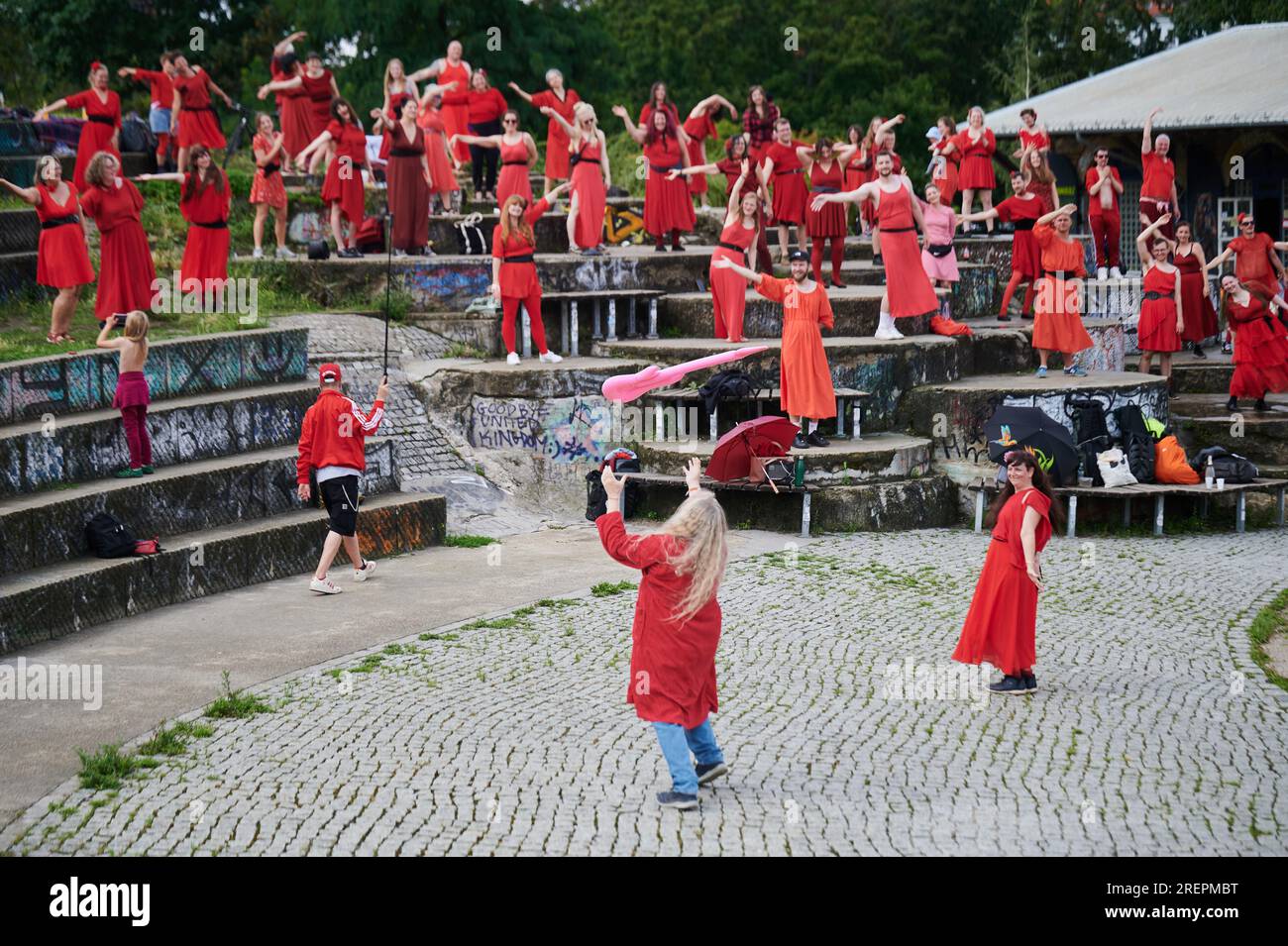 Berlin, Germany. 29th July, 2023. Women and men dressed in red dance ...
