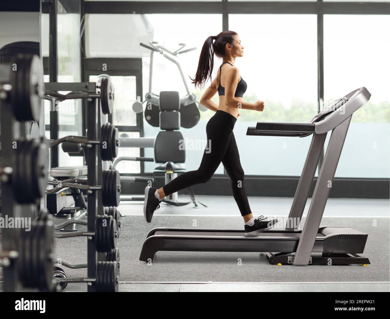 Young attractive female treadmill runner hi-res stock photography and ...