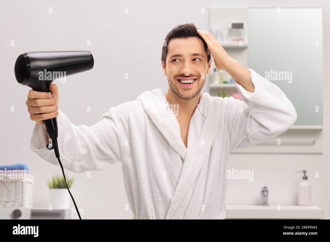 Drying hair in morning bathroom hi-res stock photography and images - Alamy
