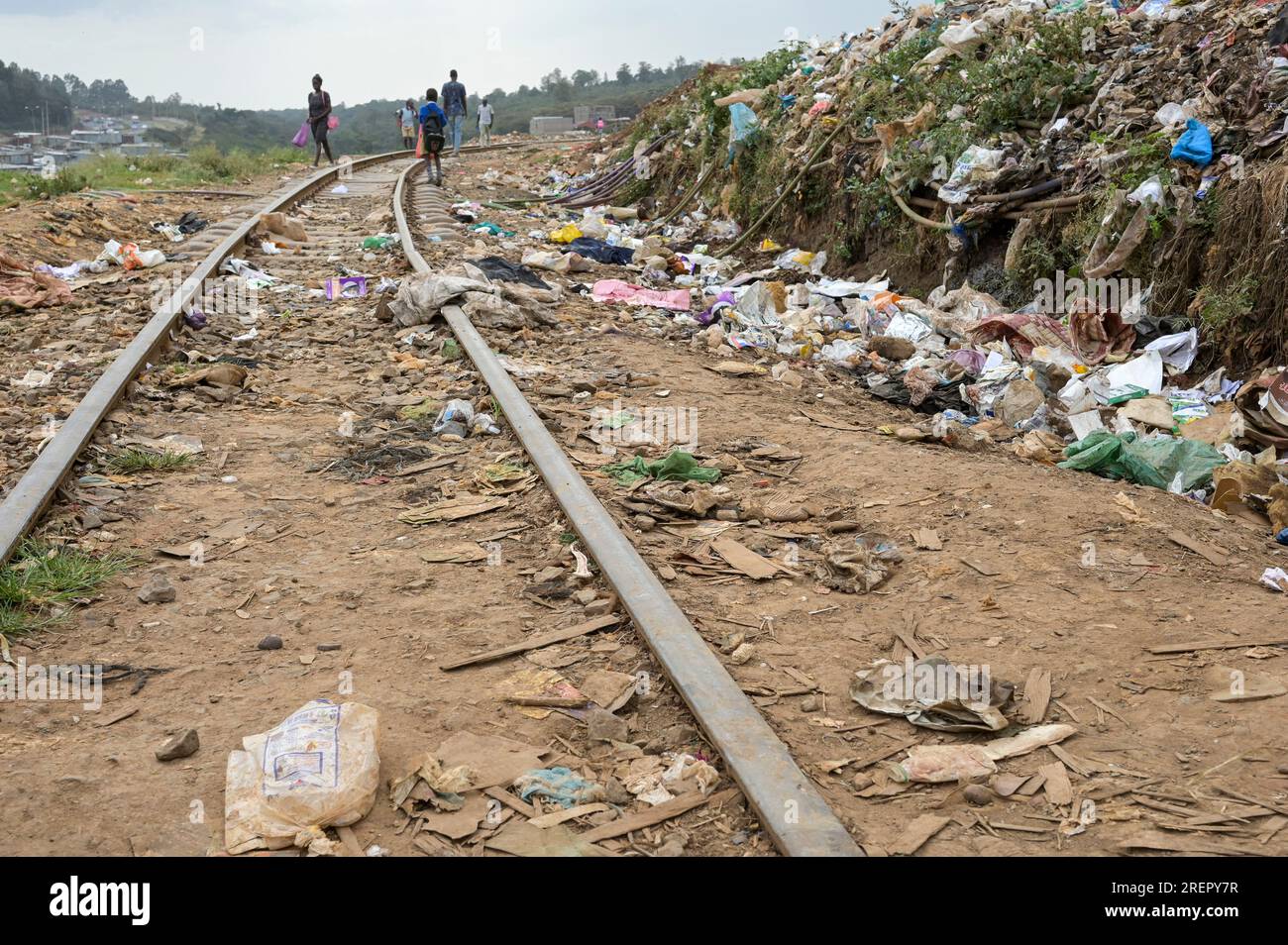 KENYA, Nairobi, Kibera slum, children at railway track, dumped garbage ...