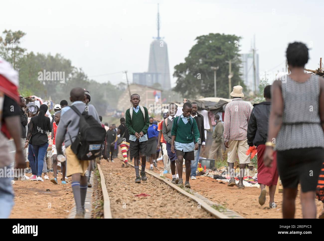 KENYA, Nairobi, Kibera slum, peole walk along the railway track / KENIA ...