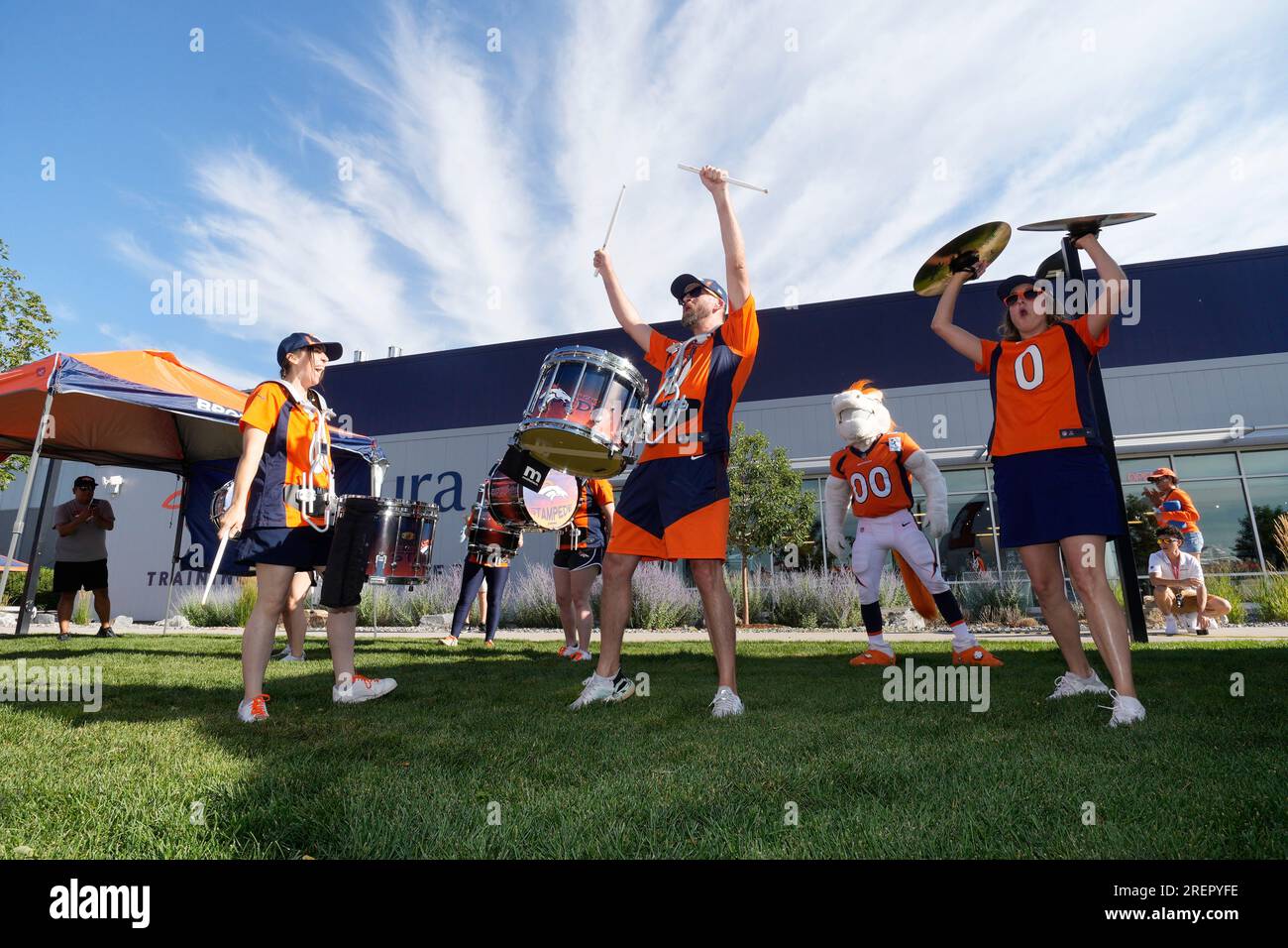 The band Stampede performs for fans as they enter team headquarters ...