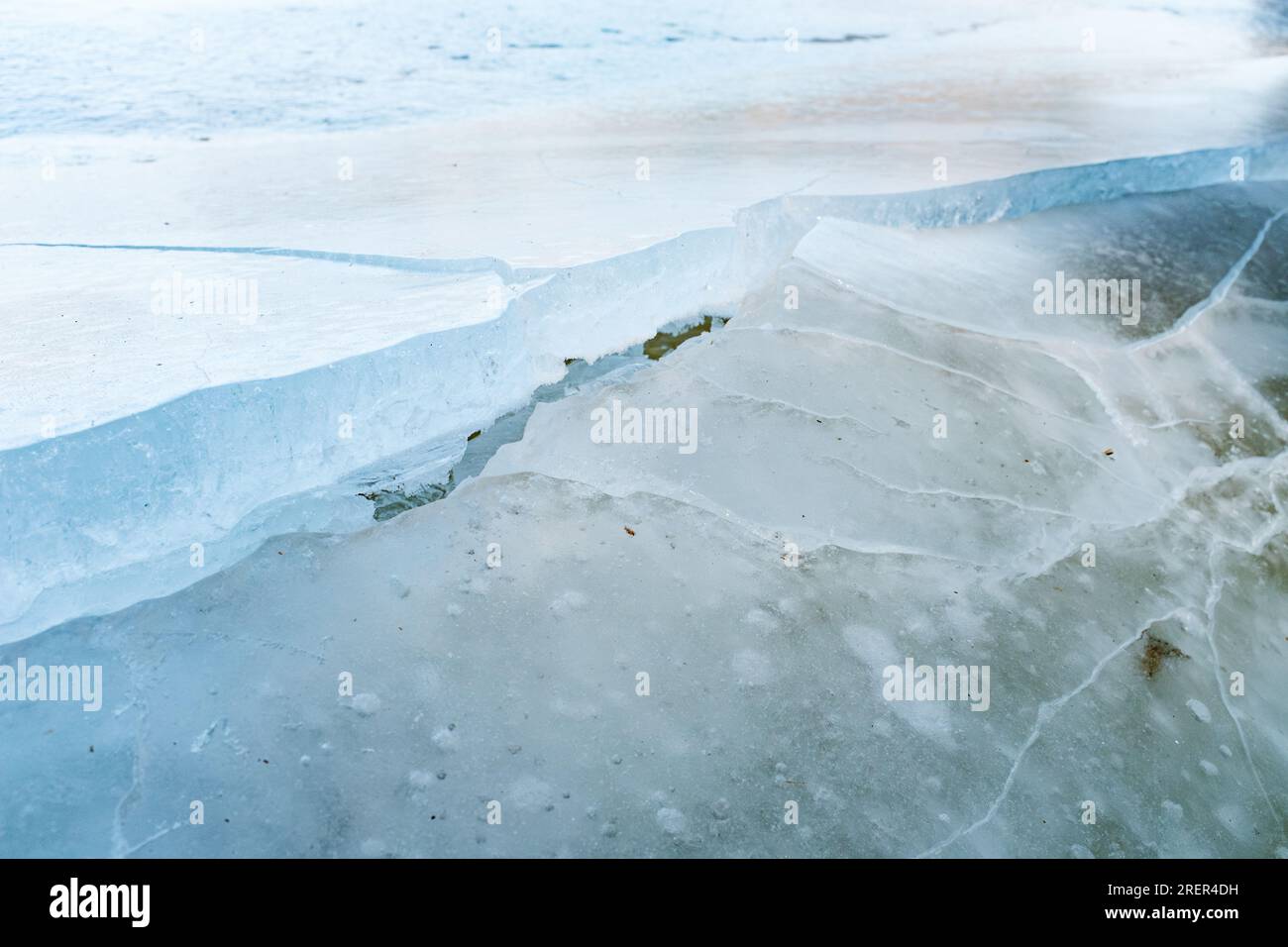 Lake ice crack - Close up view of cracking ice at the surface of a ...
