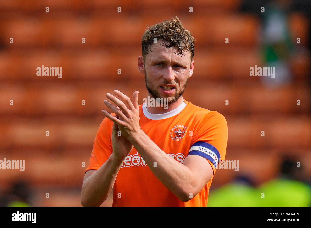 Matthew Pennington #5 of Blackpool salutes the fans after the Pre ...