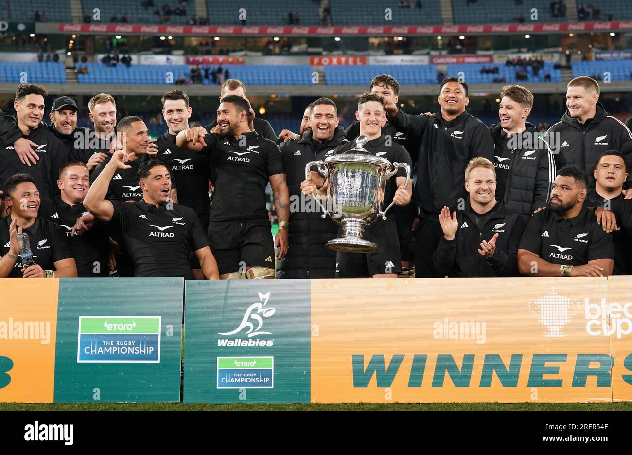 Melbourne, Australia. 29th July, 2023. Cam Roigard of New Zealand holds the Bledisloe Cup as Sam ...