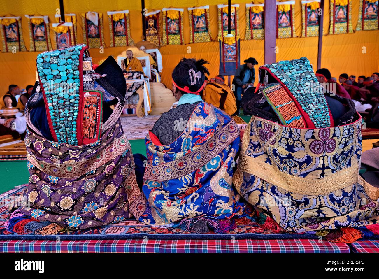 Ladakhi women in traditional clothing (perak headdress) at a high lama ...