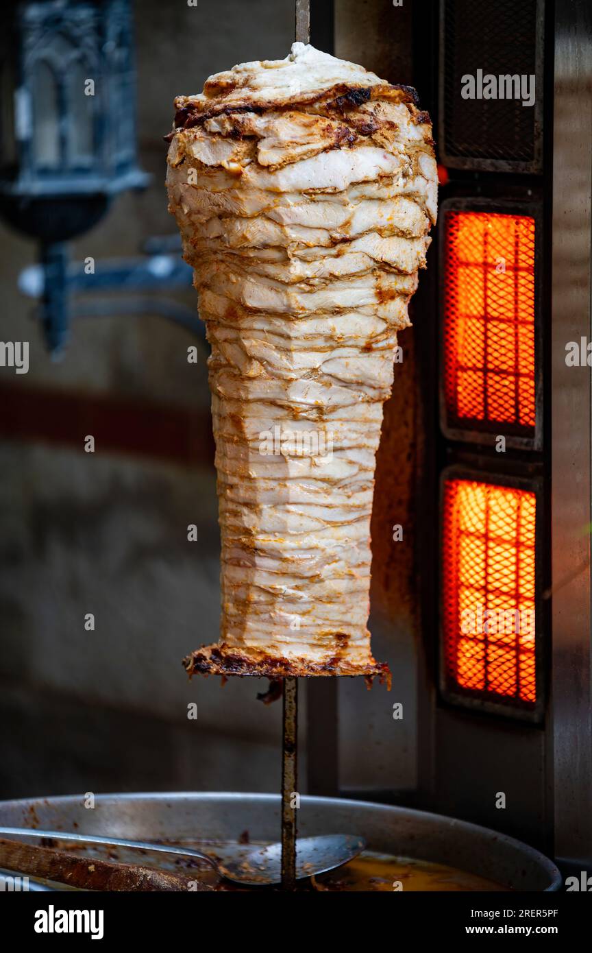 Doner Kebab cooking on rotating vertical spit Stock Photo - Alamy