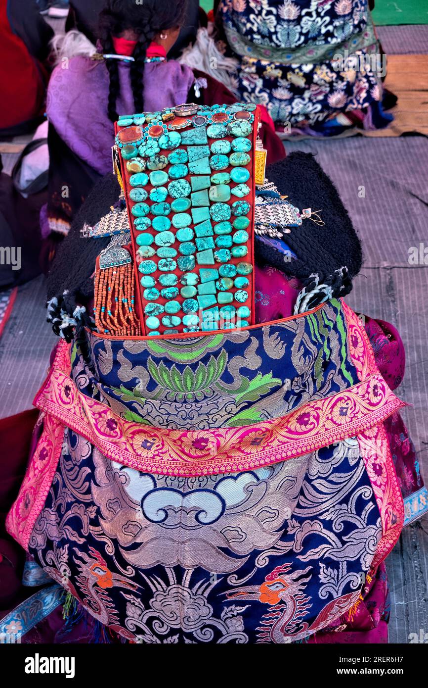 Ladakhi woman in traditional clothing (perak headdress) at a high lama ...