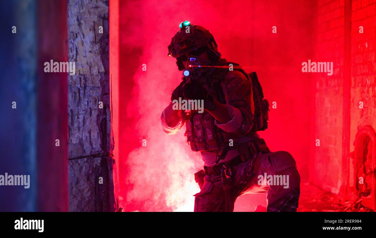 Expert team of soldiers with weapons attacking enemy during military ...