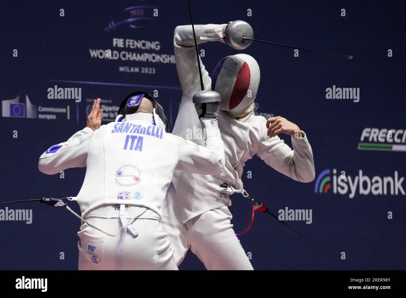 Italy's Andrea Santarelli, left, competes against France's Alexandre ...