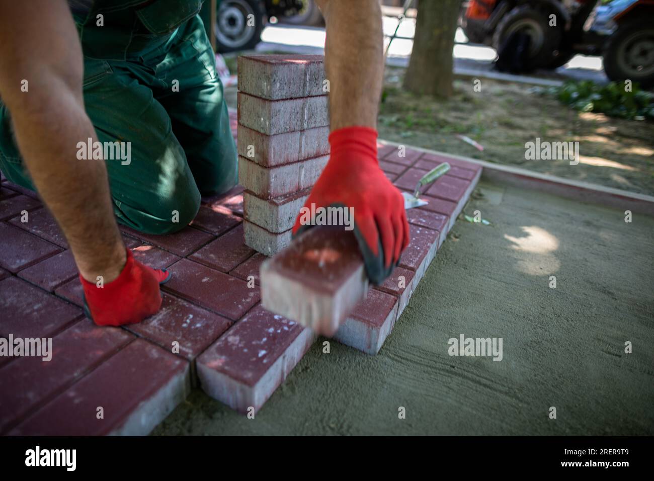 Paving work for laying a new pedestrian path is being done in the ...
