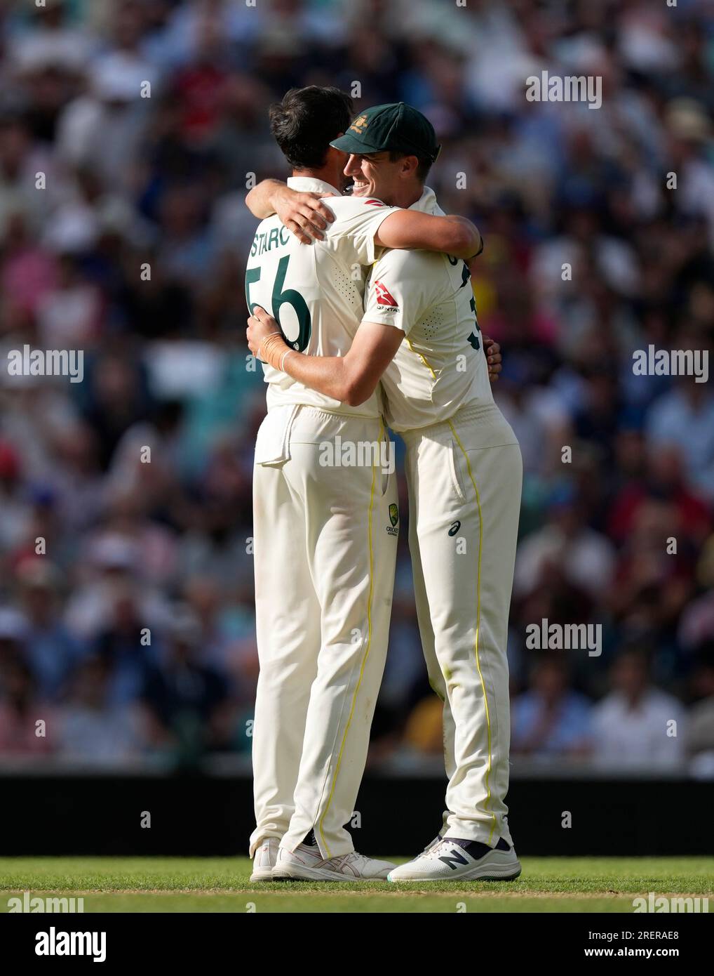 Australia's Mitchell Starc, left, with Australia's Pat Cummins, right ...