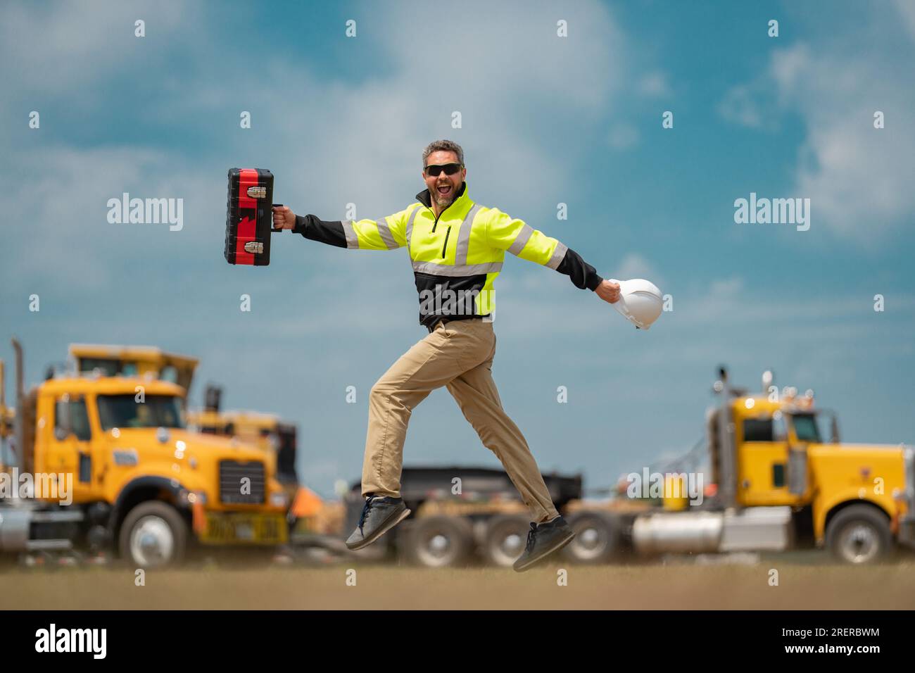 Crazy builder excited jump on site construction. Excited builder ...