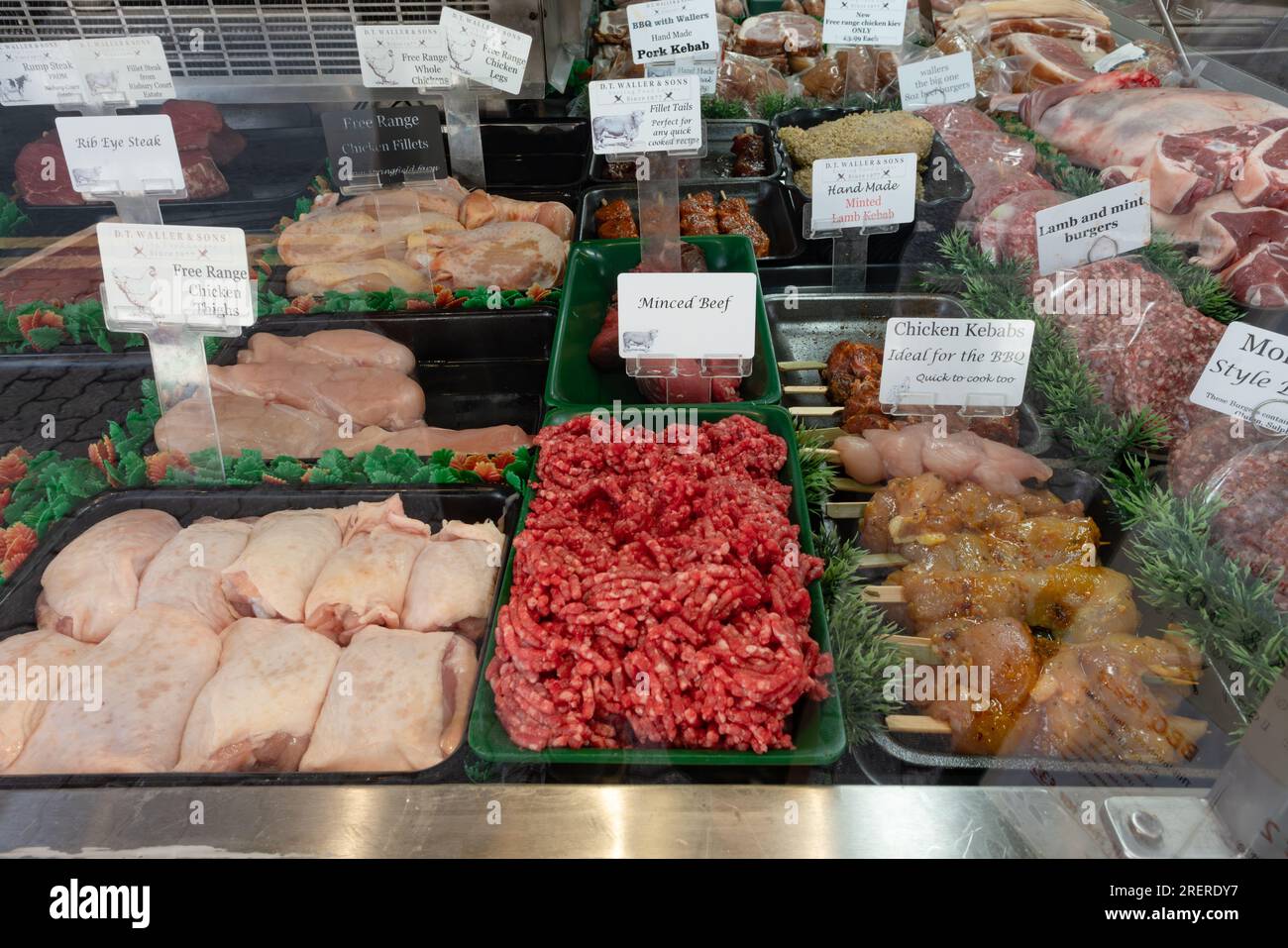 The butcher shop's refrigerated display showcases a variety of raw ...