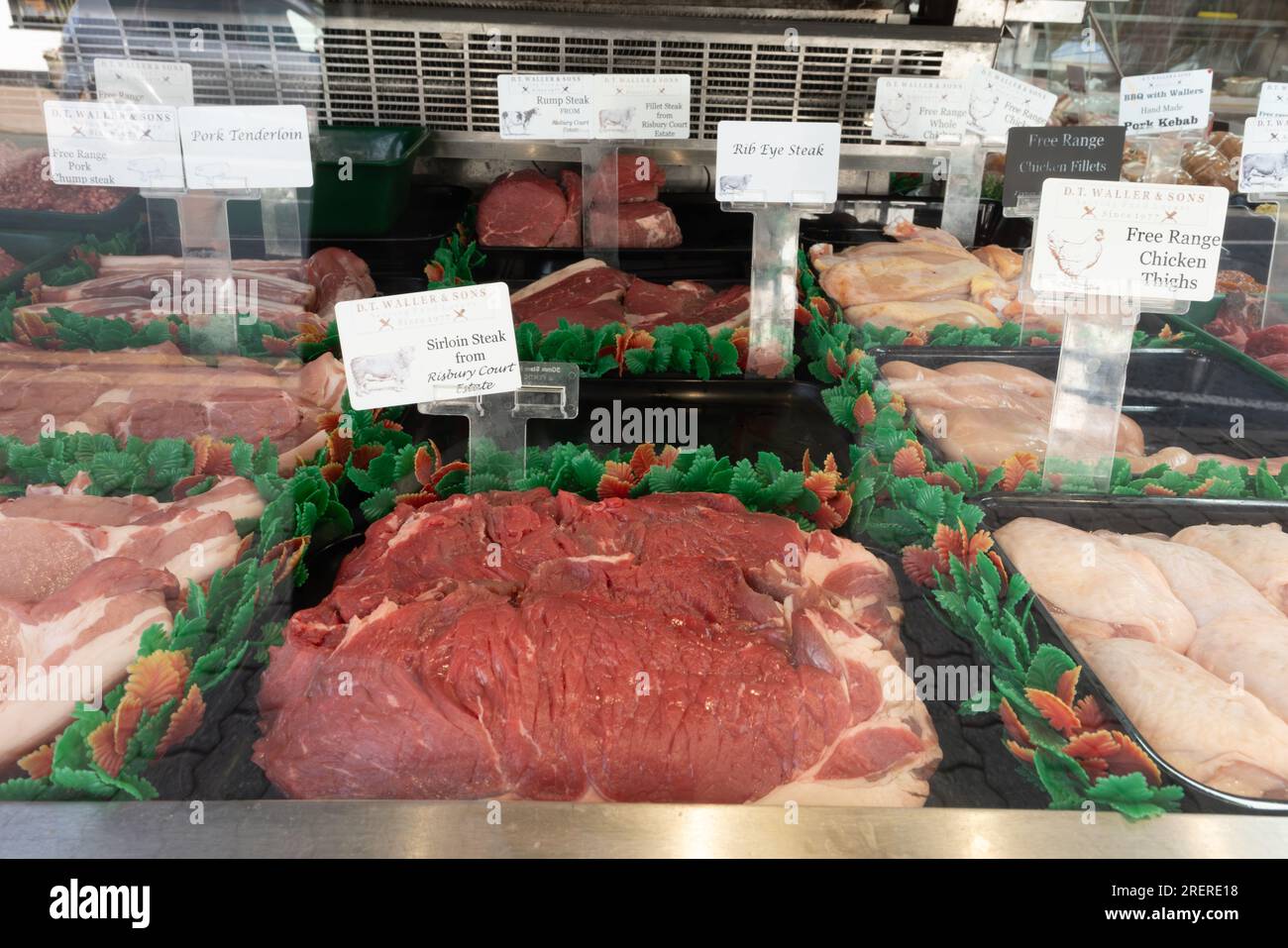The butcher shop's refrigerated display showcases a variety of raw ...