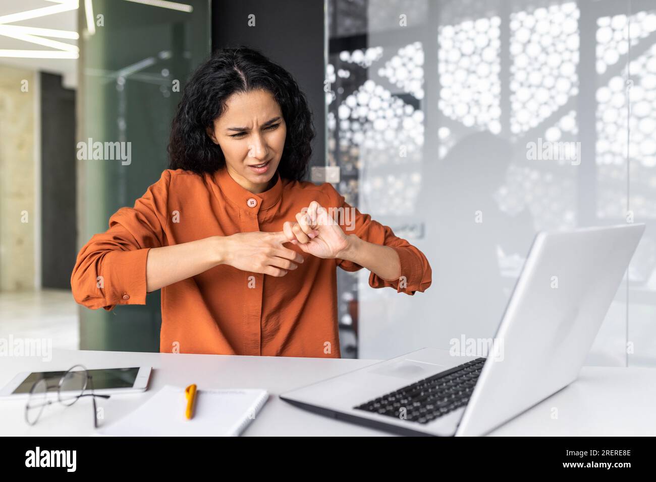 Female office worker overtired has severe pain in fingers and joints ...