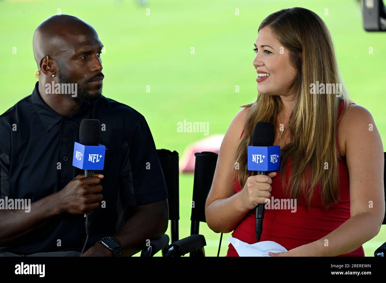 NFL Network reporters Jason McCourty and Amie Wells work on the field ...
