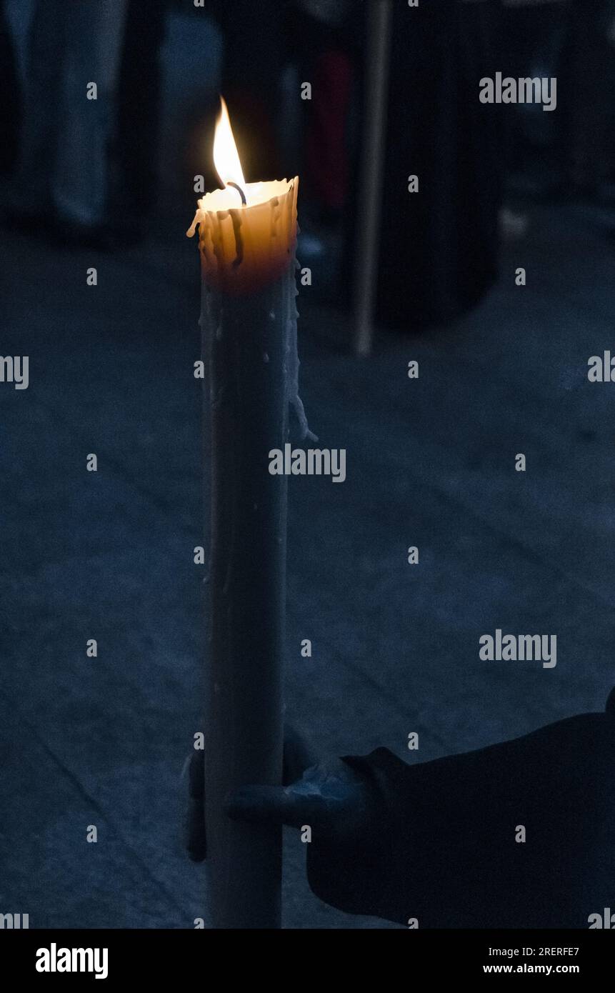 Candle lit during a traditional Holy Week procession in Spain Stock ...