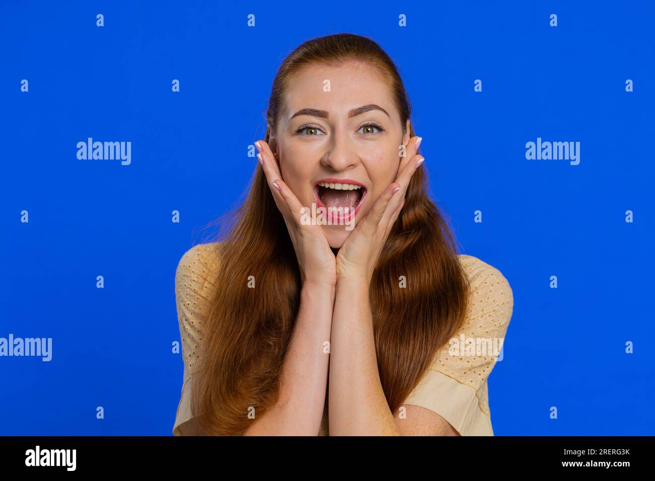 Oh my God, Wow. Excited amazed winner woman raising hands in surprise ...