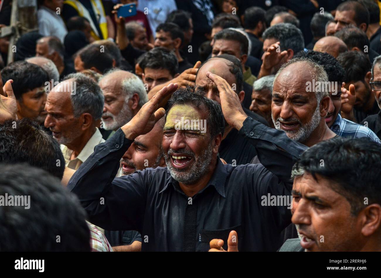 Srinagar, India. 29th July, 2023. A Kashmiri Shiite Muslim cries as he attends a religious ...