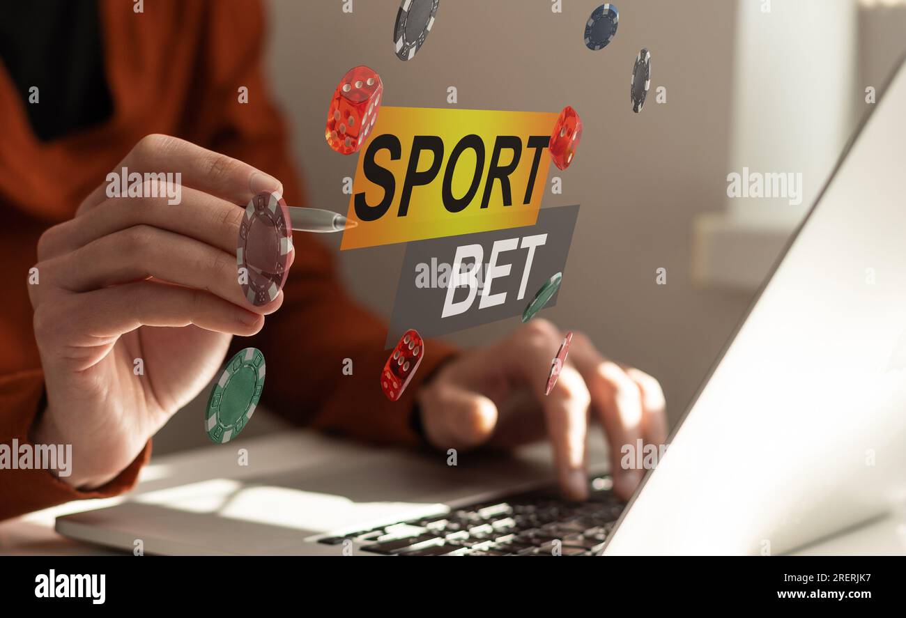 Sports betting concept on laptop computer screen on wooden table. Hands ...