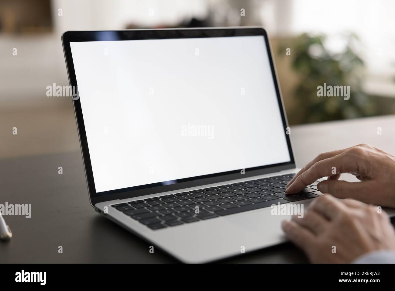 Empty white laptop display on work table of business woman Stock Photo ...