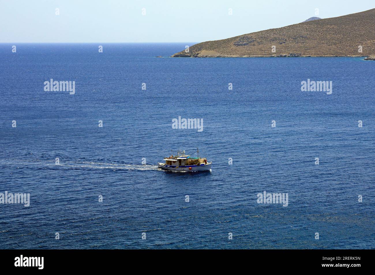 Local fishing boat coming back into Livadia harbour, Tilos island ...