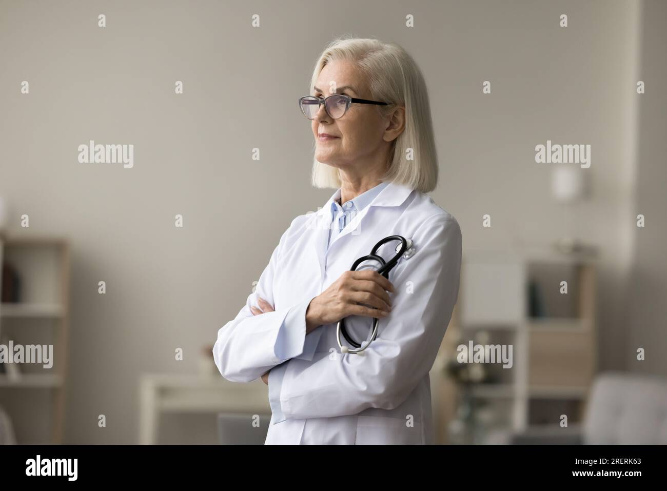 Pensive senior elder doctor woman in glasses and uniform coat Stock ...