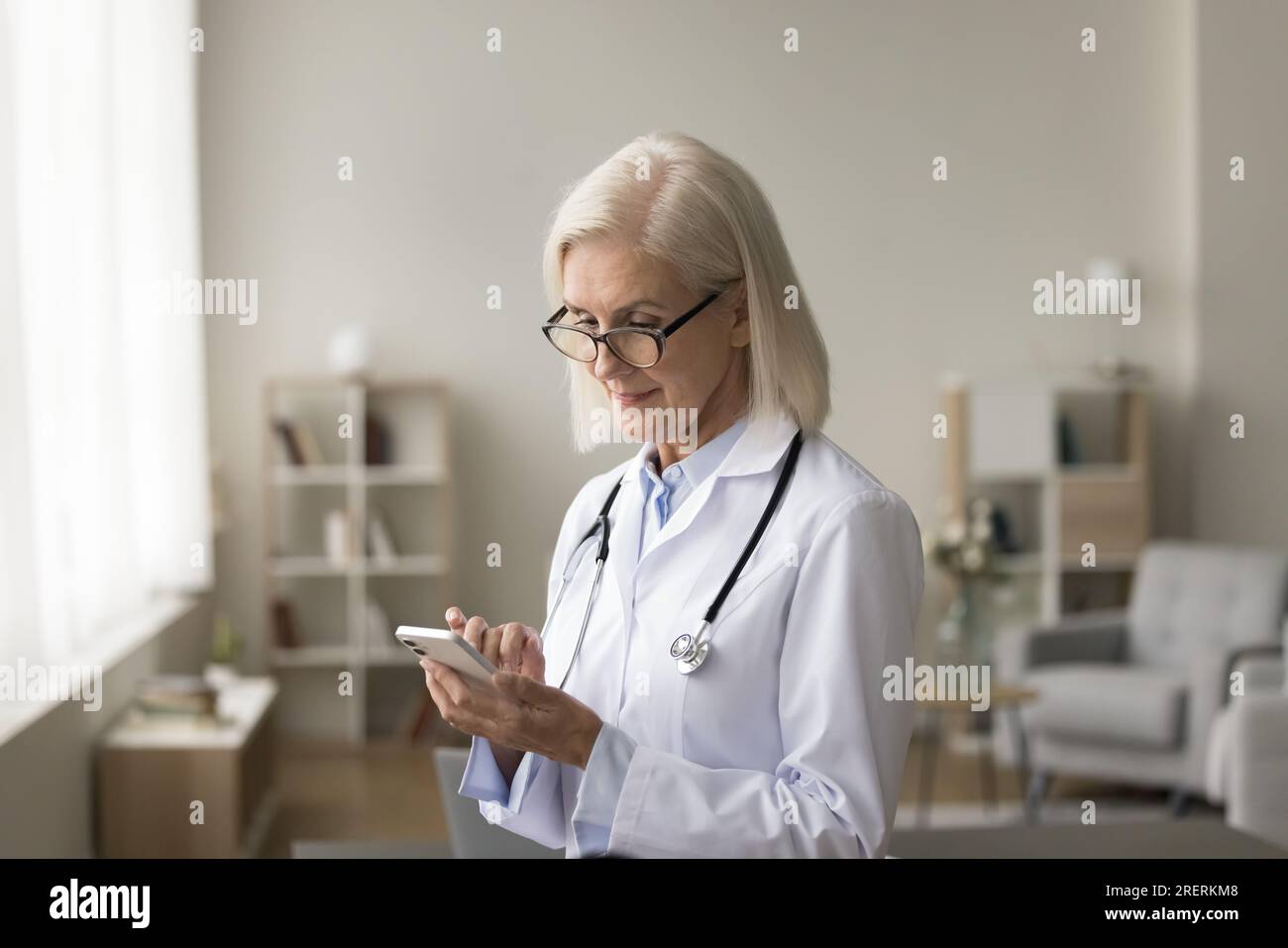 Doctor checking patient schedule hi-res stock photography and images ...