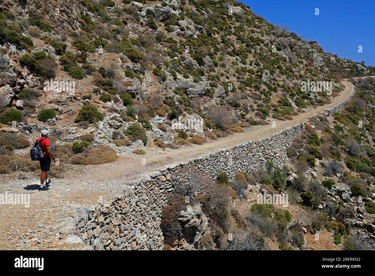 Solitary walker on the path from Livadia to Lethra beach along the ...