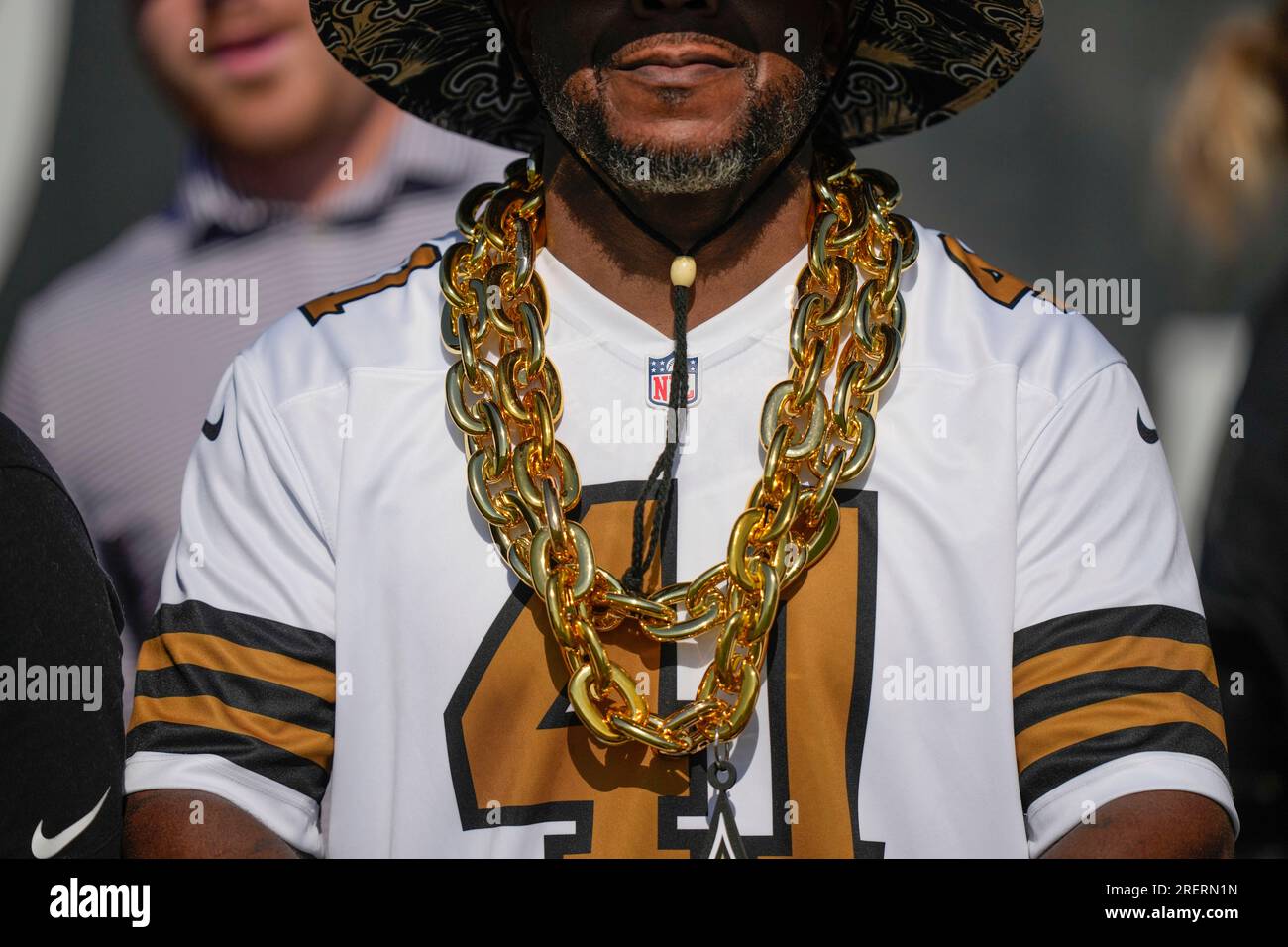 A New Orleans Saints fan waits for the start of practice during the ...
