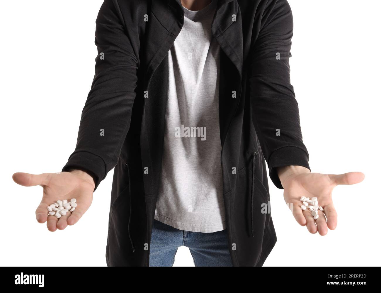 Male drug addict with pills on white background, closeup Stock Photo ...