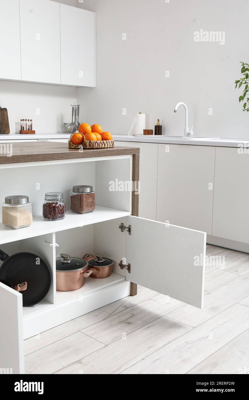 Counter with food and utensils in light kitchen Stock Photo - Alamy