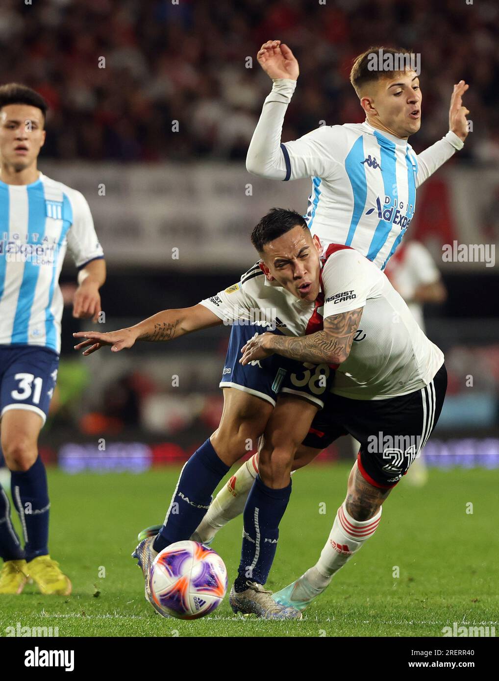 River Plate's midfielder Esequiel Barco (R) is fouled by Racing Club's ...