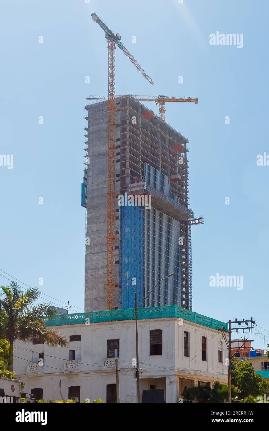 Havana, Cuba, Construction site with cranes of a tall building in the ...