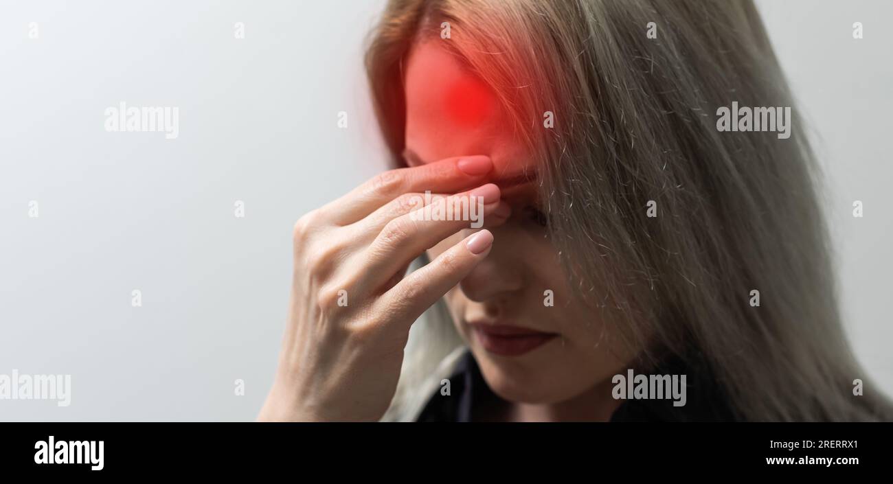 girl having headache red spot pain migraine Stock Photo - Alamy
