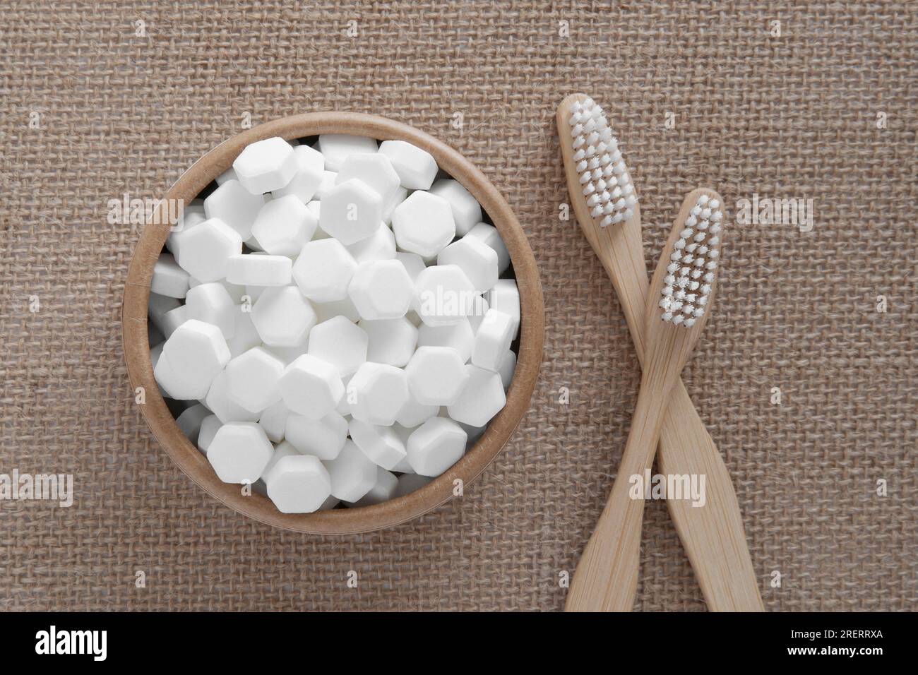 White solid toothpaste tablet with bamboo toothbrush Stock Photo - Alamy