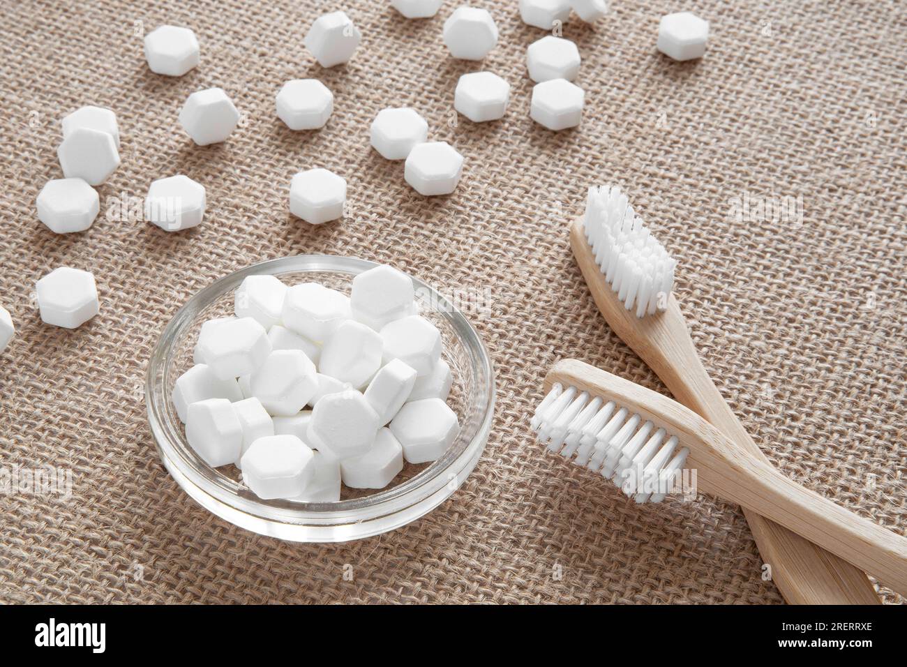 White solid toothpaste tablet with bamboo toothbrush Stock Photo - Alamy